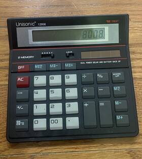 1295B UNISONIC Calculator Dual Power Solar Battery Backup