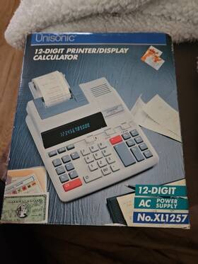 XL1257 UNISONIC Calculator Adding